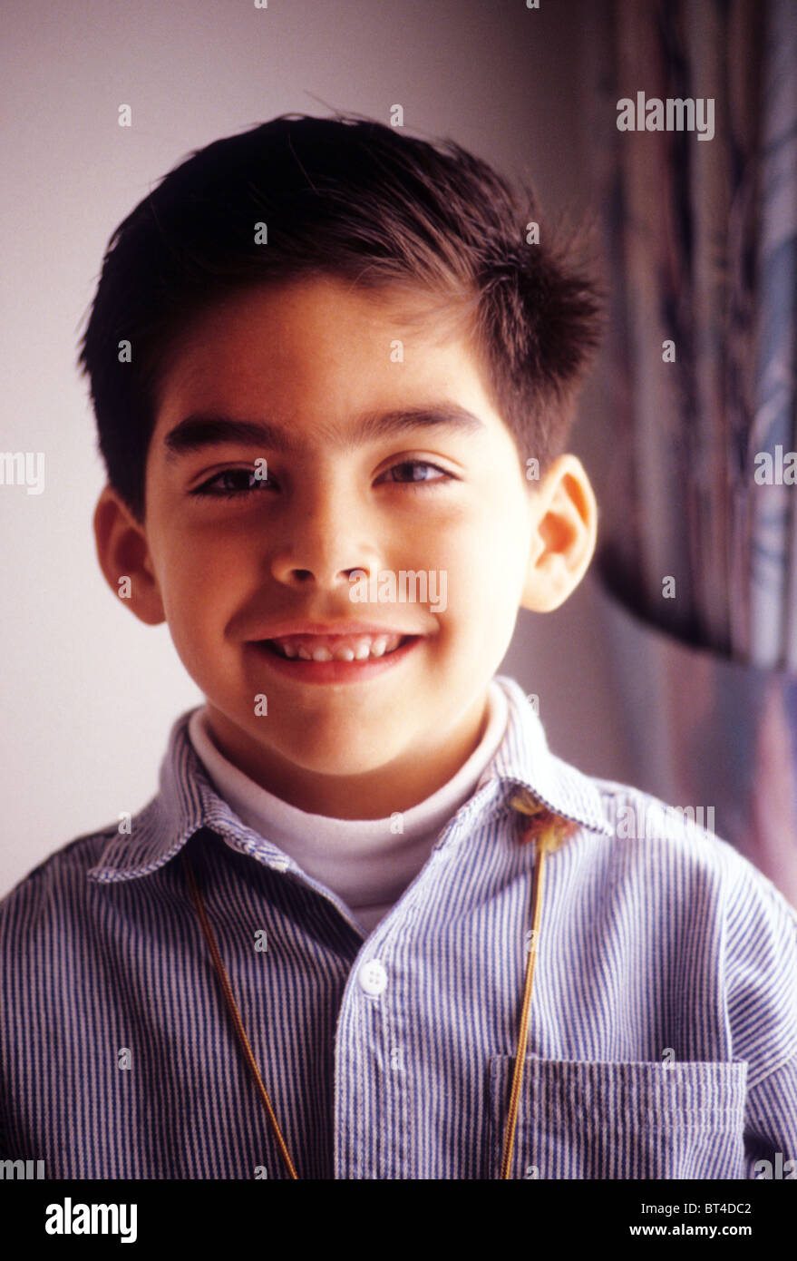 Young Hispanic boy laugh male happy fun smile love cozy sun warm friend ...