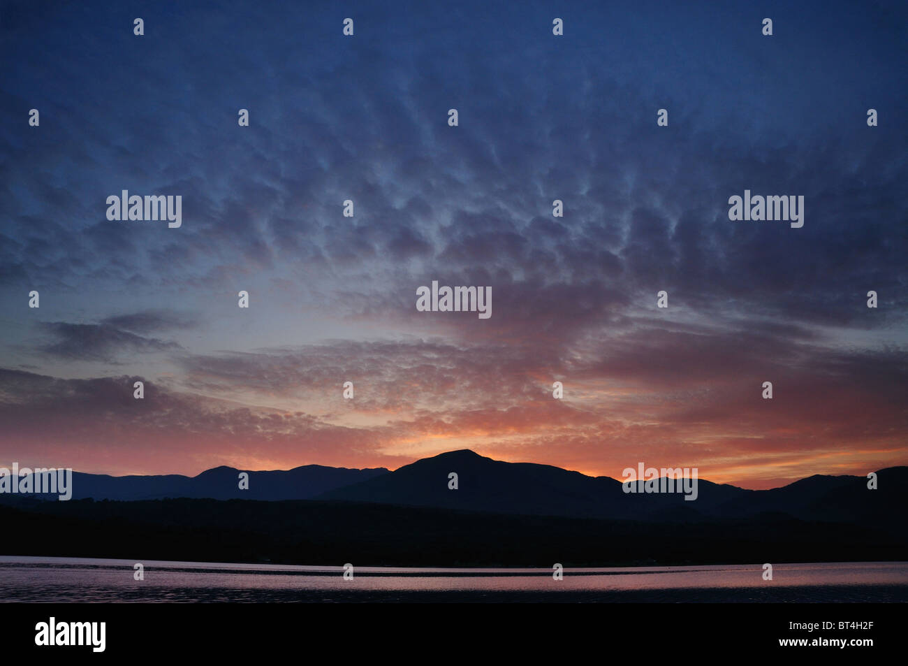 Dramatic sunset sky over Coniston Water and the Old Man of Coniston ...