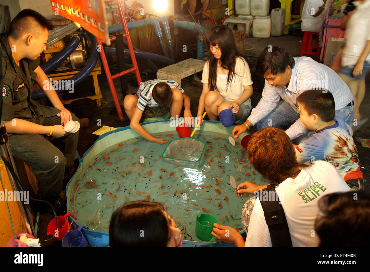 People playing fishing game , Bangkok Stock Photo - Alamy