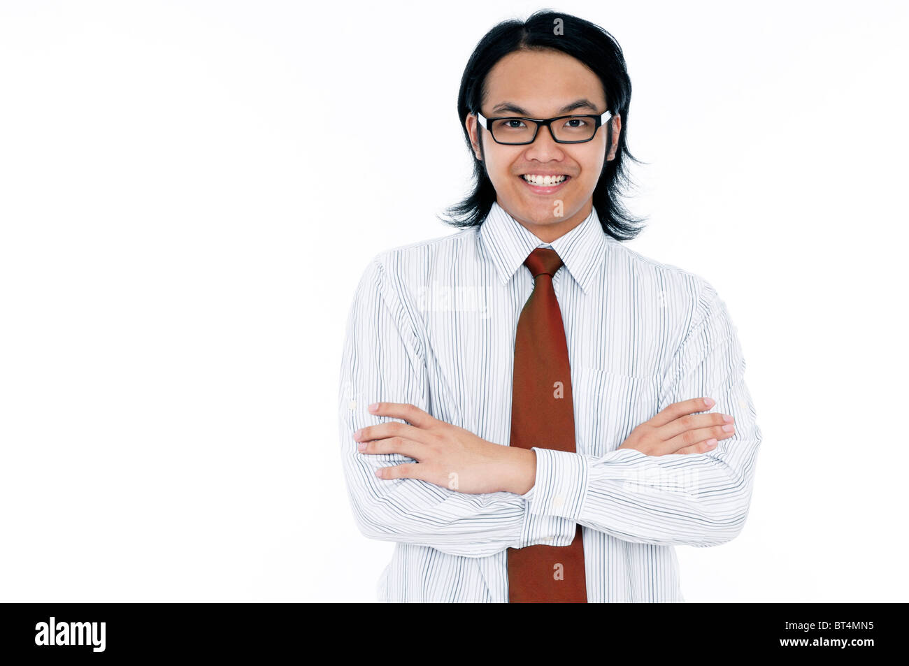 Handsome young businessman smiling, portrait Stock Photo - Alamy