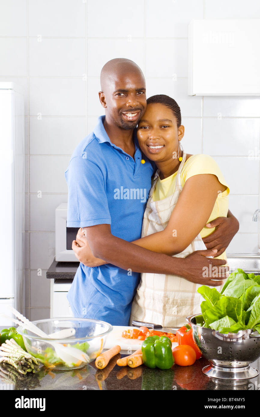 young african american couple in kitchen cooking food Stock Photo - Alamy