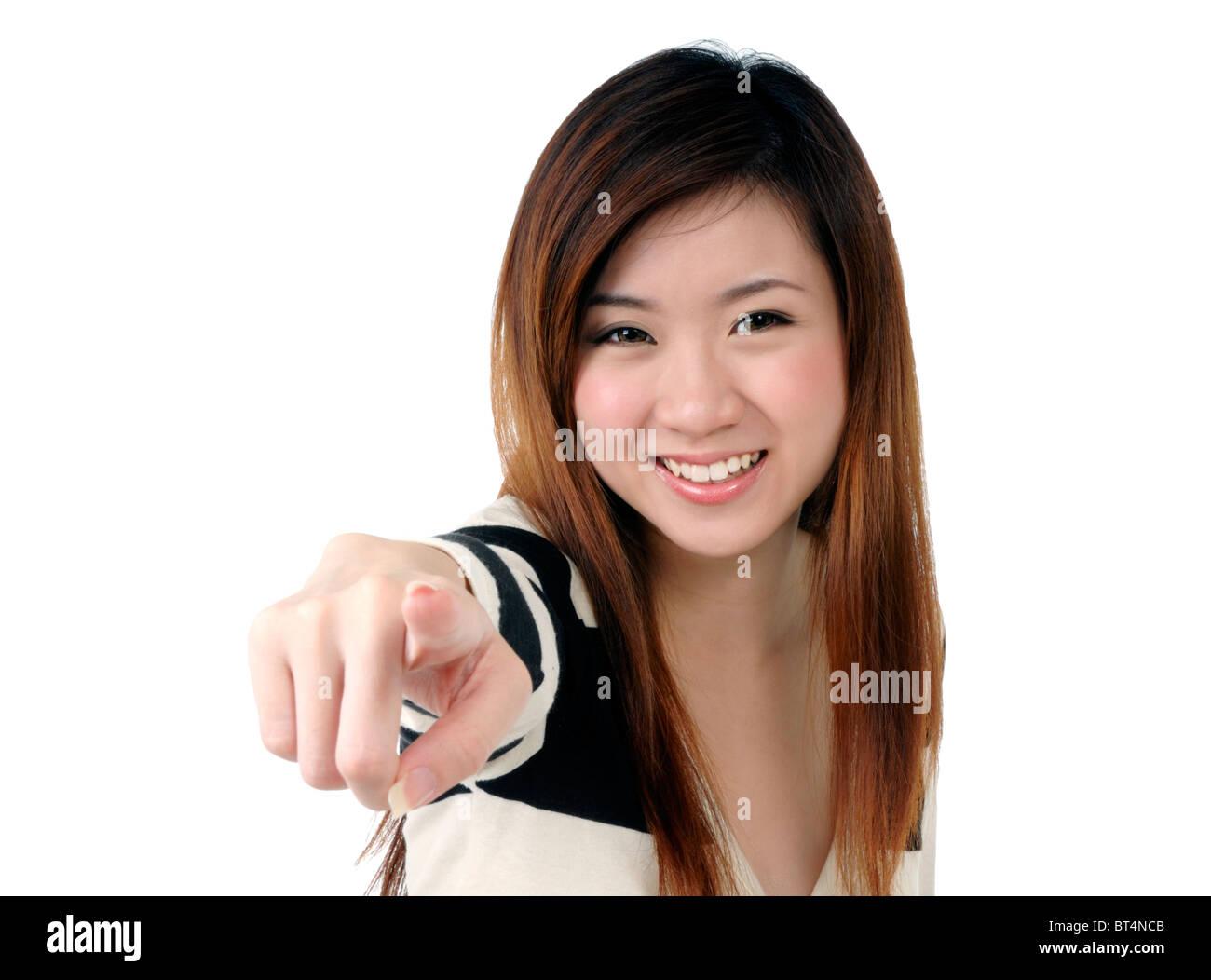Excited young woman pointing at camera, portrait Stock Photo - Alamy