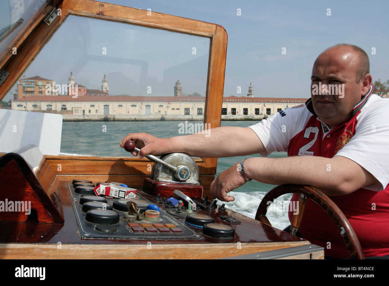 Boat operator in Venice, Italy Stock Photo - Alamy