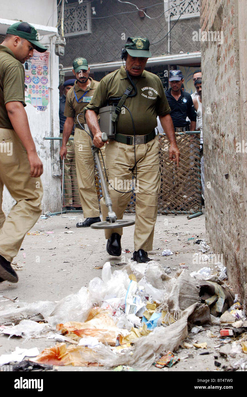 Bomb disposal squad officials examine the site of cracker blast in ...