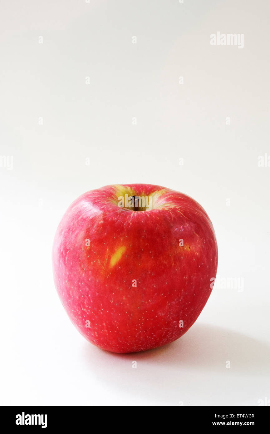 A bright red honey crisp apple on a white background Stock Photo - Alamy