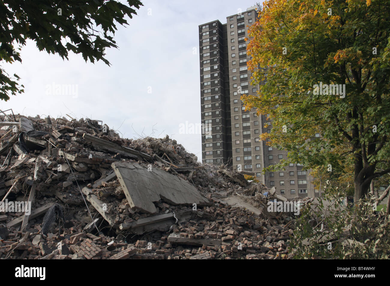 block of flats and pile of rubble from Norfolk Court tower blocks in ...