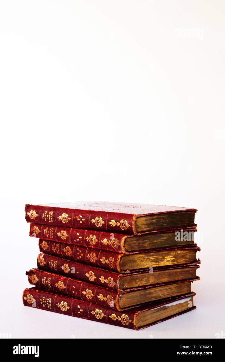 A stack of antique red leather bound Shakespeare books with gold ...