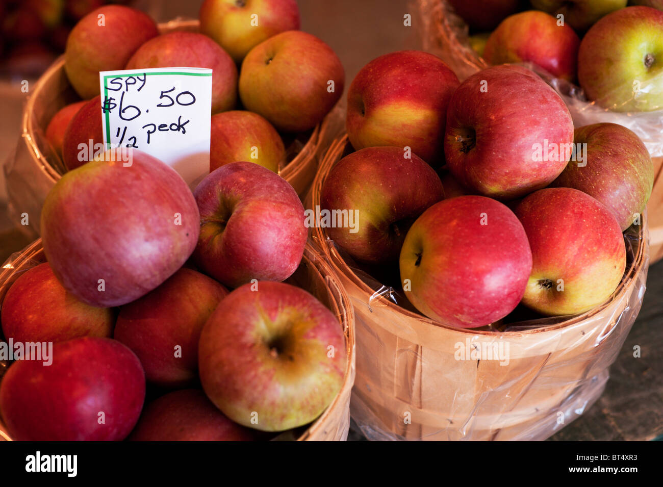 Spy apples in 1/2 peck baskets at an Ontario farm store Stock Photo - Alamy