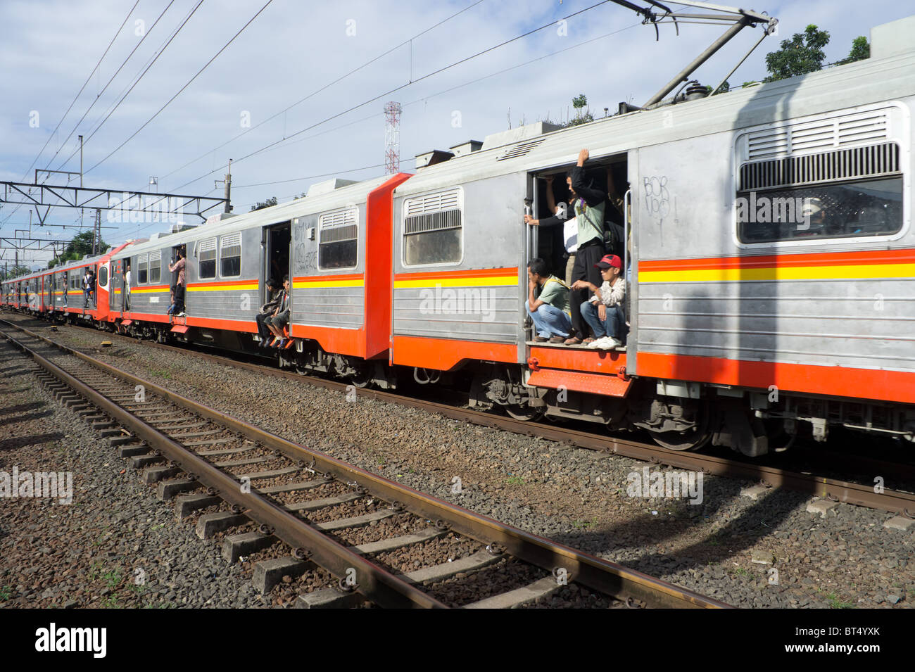 Commuter train in Jakarta, Indonesia near Pasar Minggu Station Stock ...