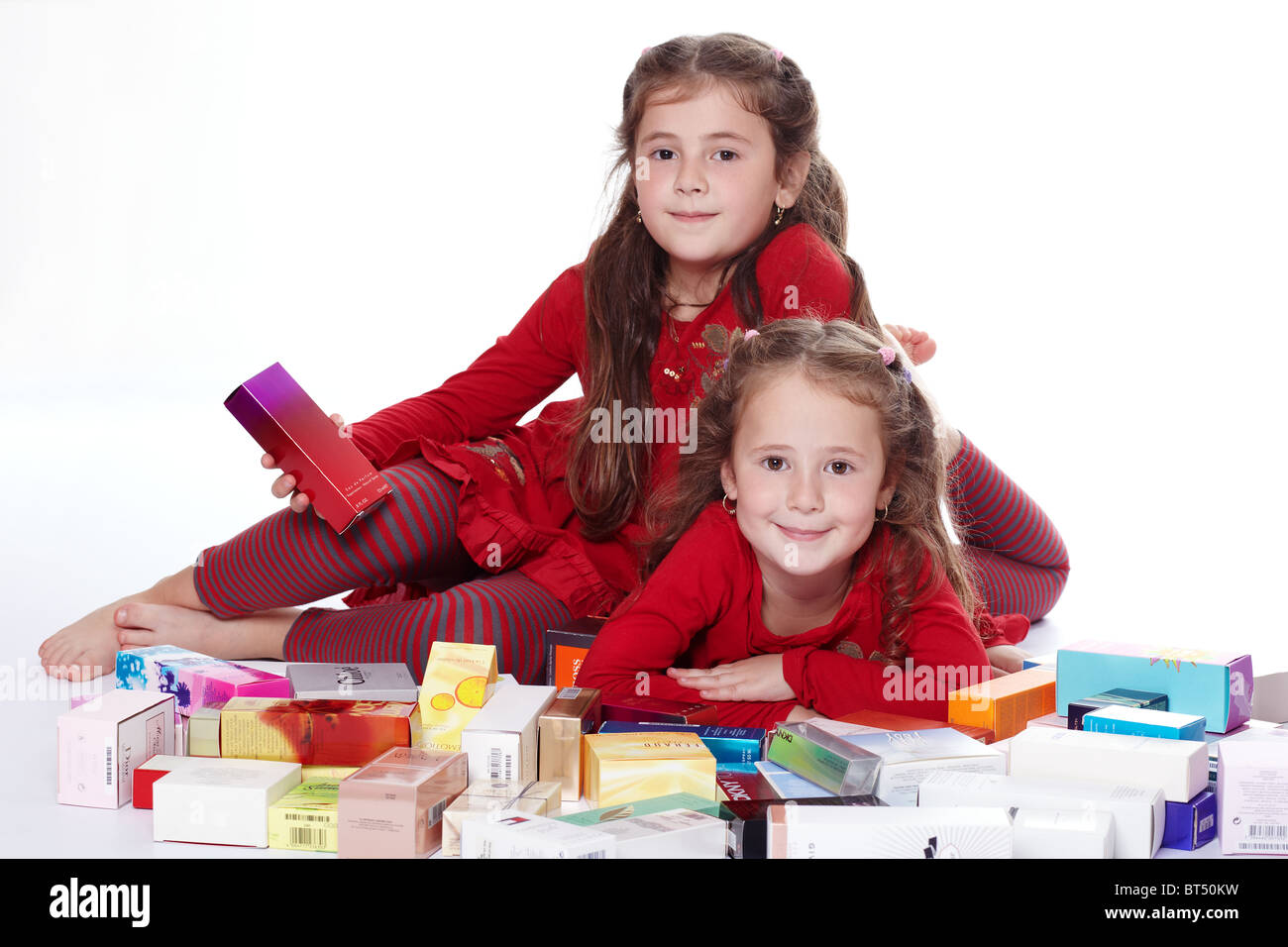 Two young girls with small boxes Stock Photo - Alamy