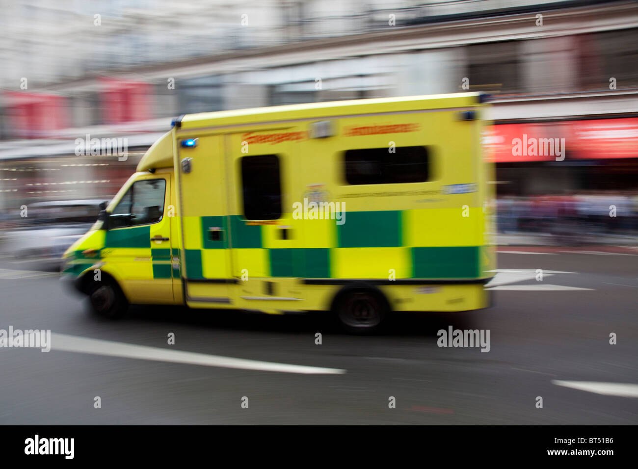 An ambulance passes at high speed in central London Stock Photo - Alamy