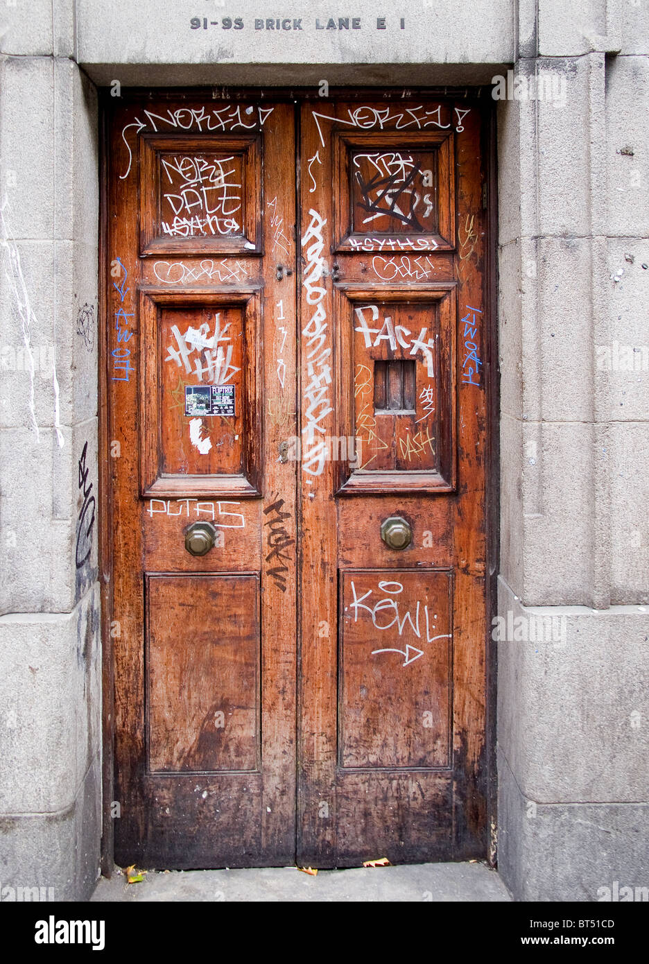 A door covered with graffiti Stock Photo - Alamy