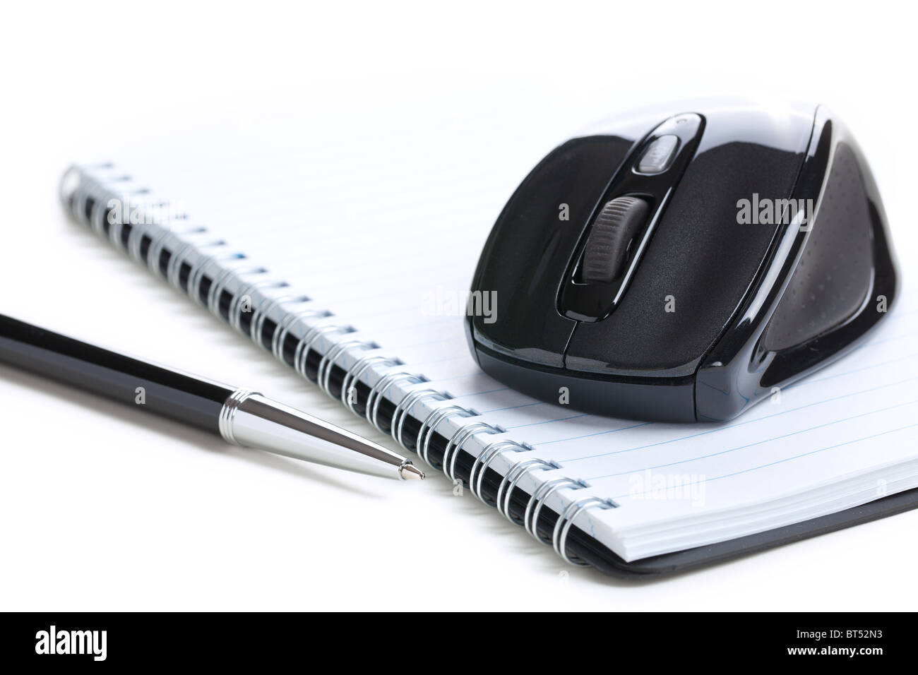 the computer mouse and notebook with pen Stock Photo - Alamy