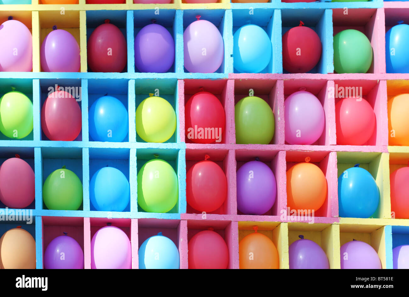 Bright colored balloons in the wooden boxes Stock Photo - Alamy