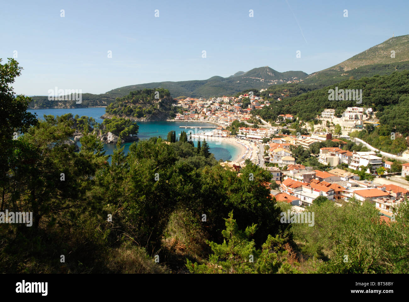 Parga, Epirus, Greece, showing the town, beach, harbour and wooded ...