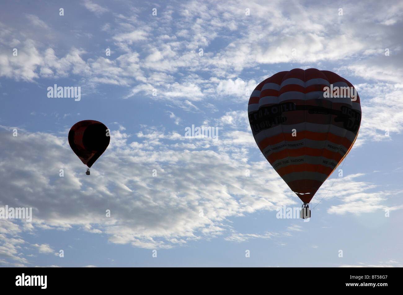 two hot air balloons against a blue sky Stock Photo - Alamy