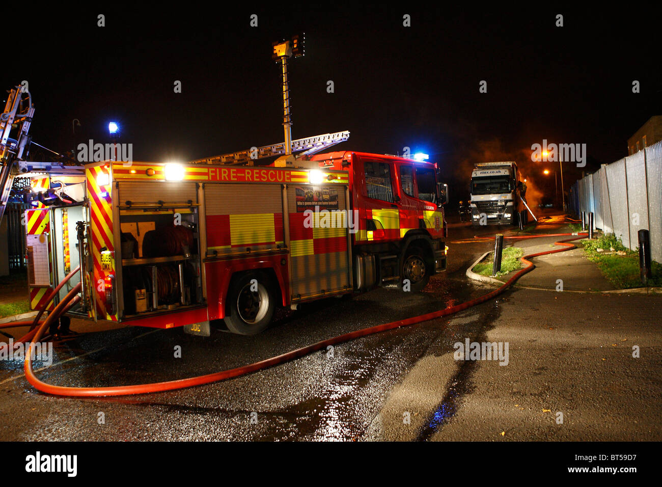 Fire engine at the scene of a lorry fire Stock Photo - Alamy
