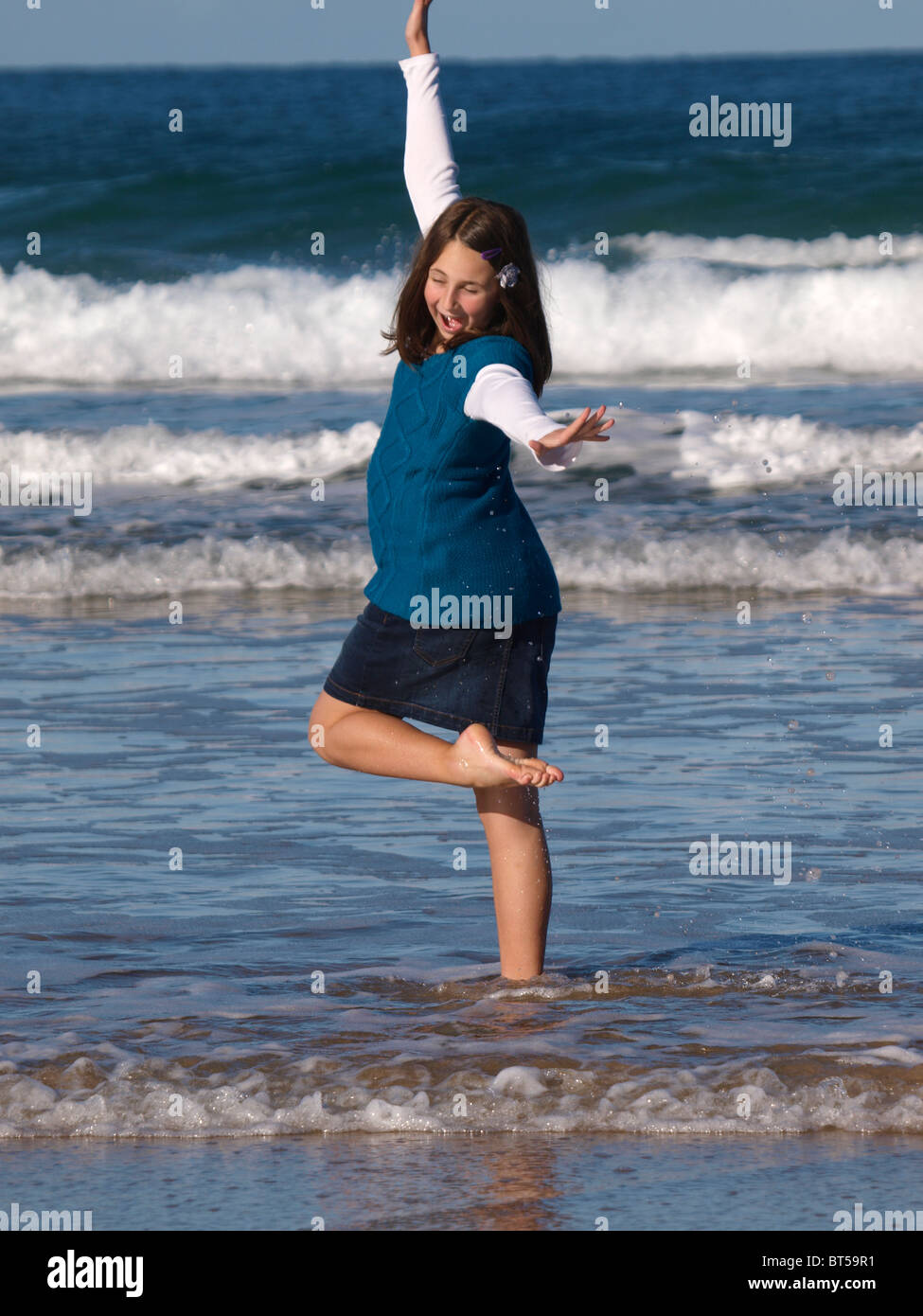 Young girl posing at the seaside, Cornwall, UK Stock Photo - Alamy