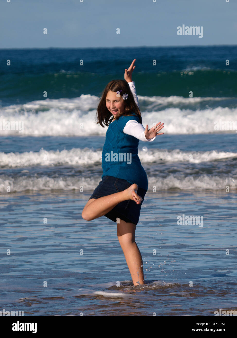 Young girl posing at the seaside, Cornwall, UK Stock Photo - Alamy