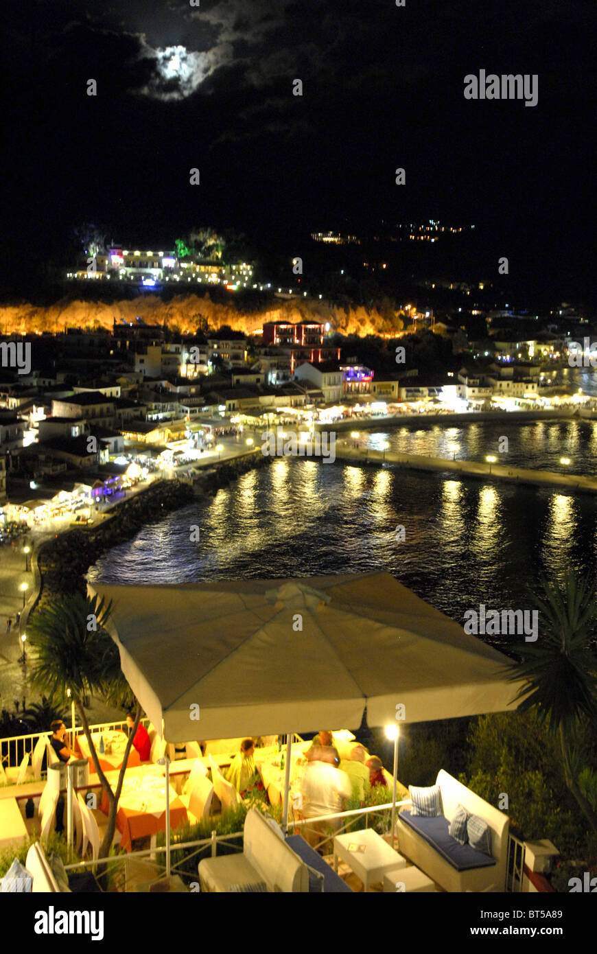 View of Parga by night from the castle, showing the seafront and ...
