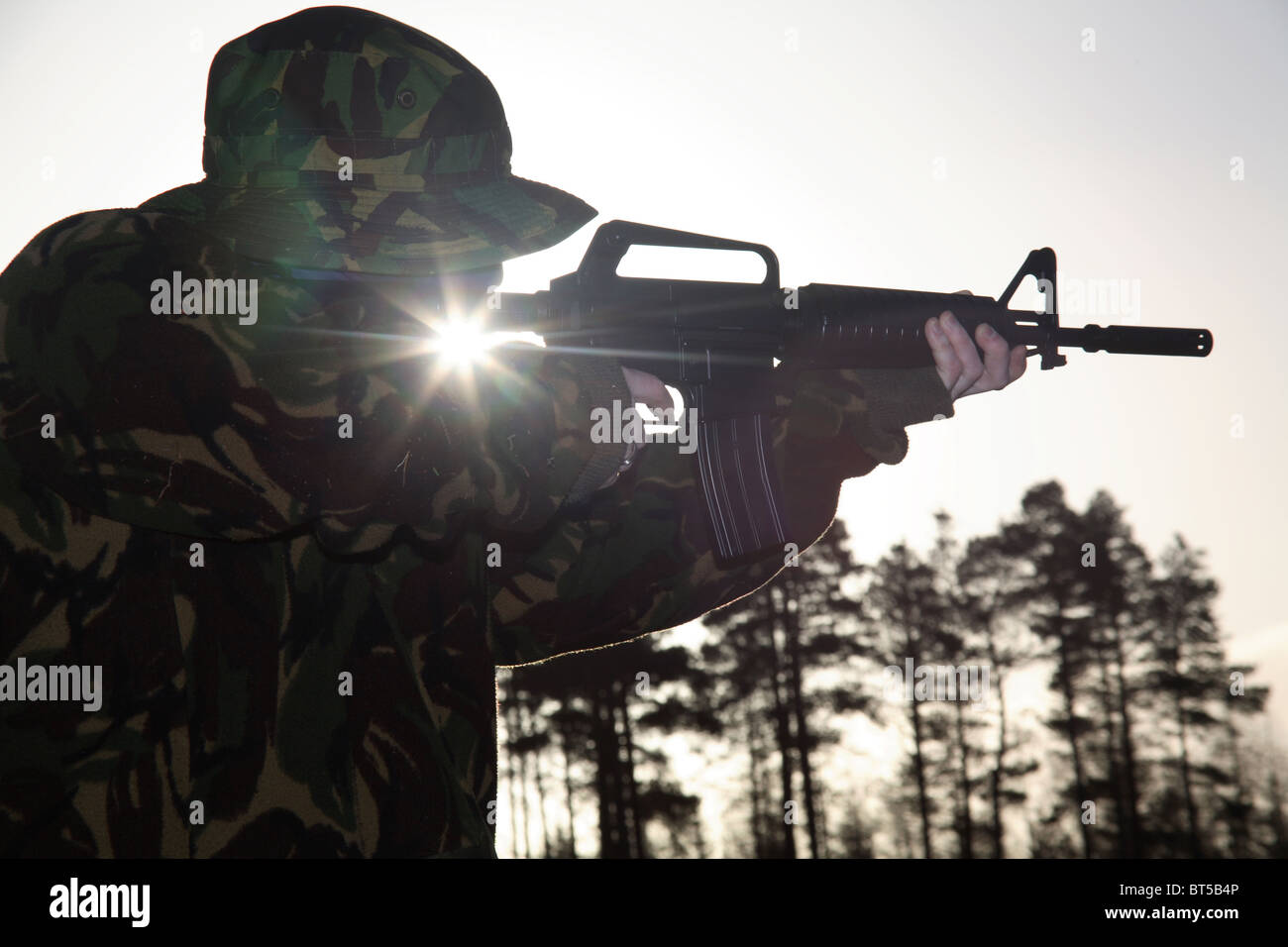 Soldier pointing machine gun hi-res stock photography and images - Alamy