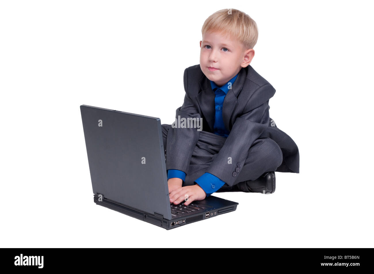 Boy typing on his laptop Stock Photo - Alamy