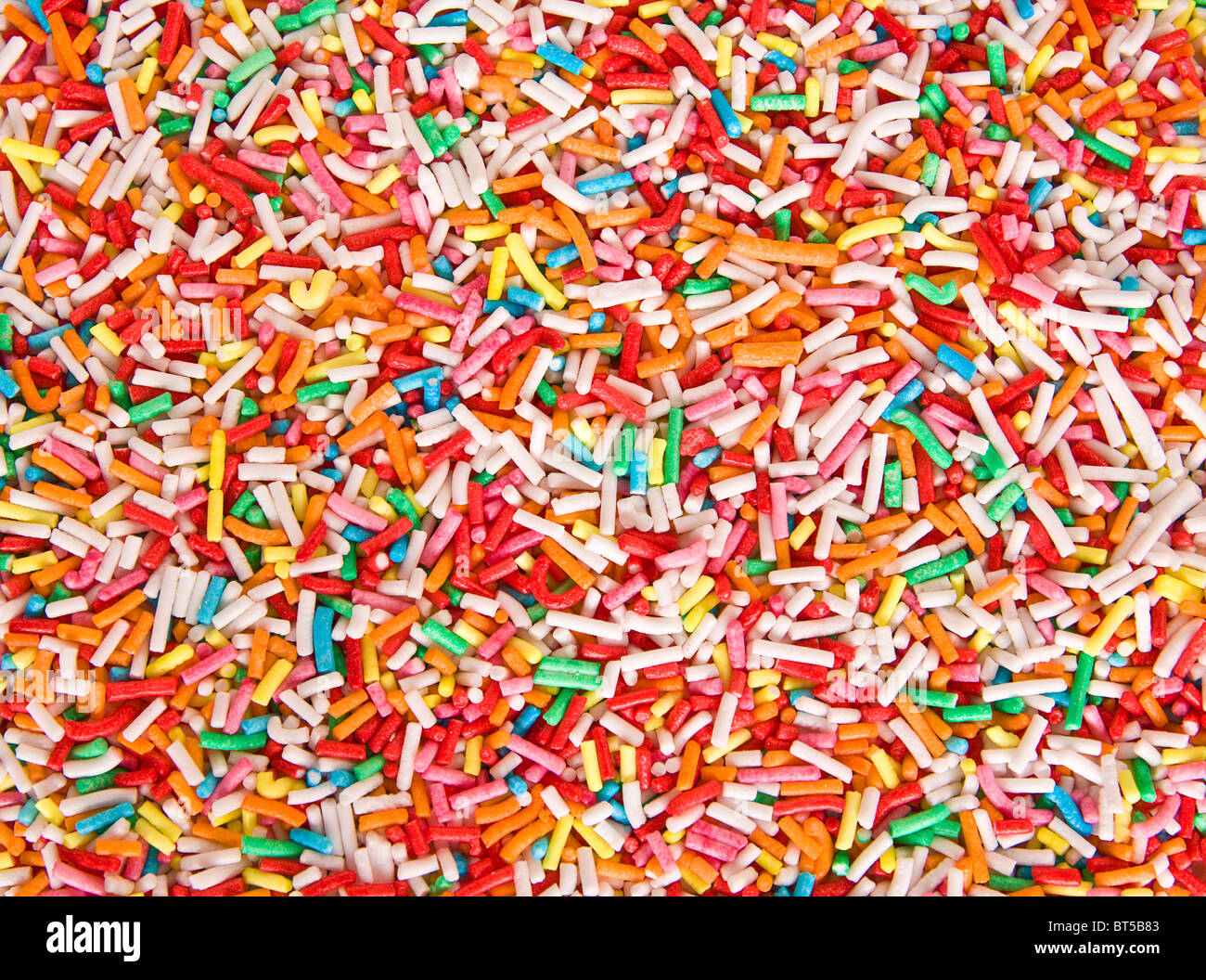 colored little candies background Stock Photo - Alamy