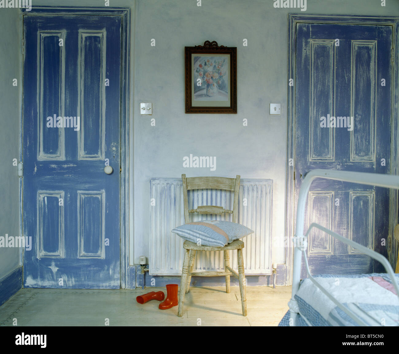 Distressed-painted blue+white doors in child's traditional bedroom with ...