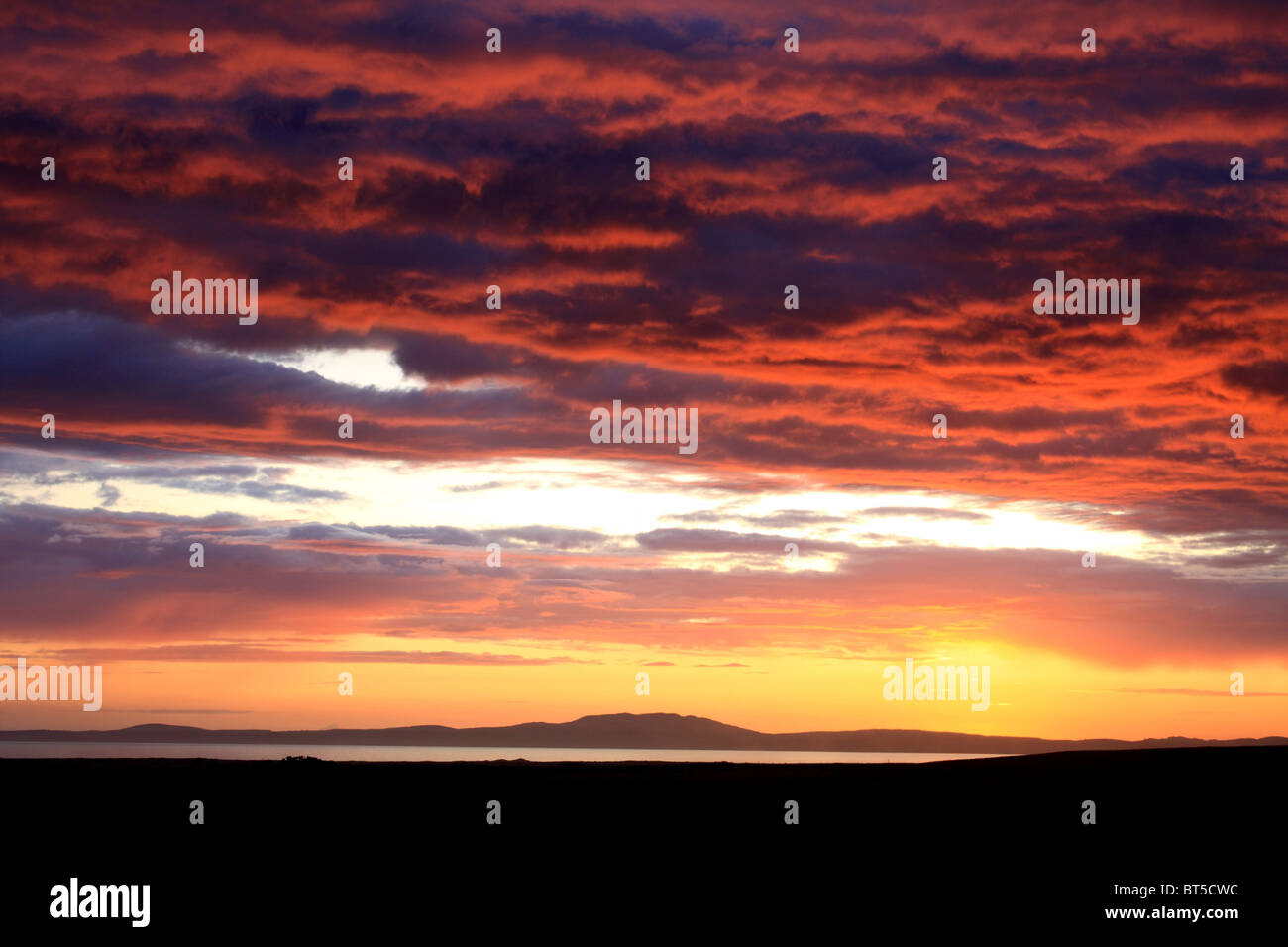 Sunset over western Islay, including the Rinns of Islay peninsula and ...