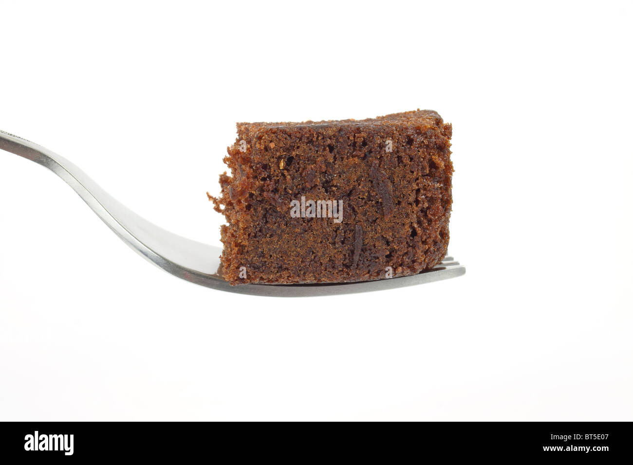 Piece of chocolate cake on fork Stock Photo - Alamy