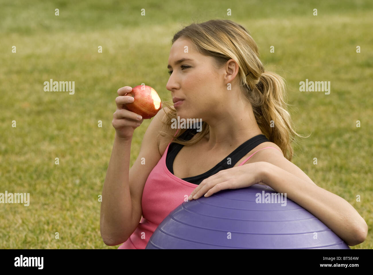 Outdoor spring training exercise in city park showing beautiful young ...