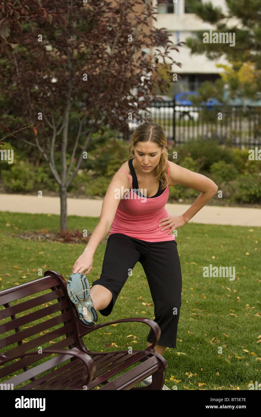 Outdoor spring training exercise in city park showing beautiful young ...