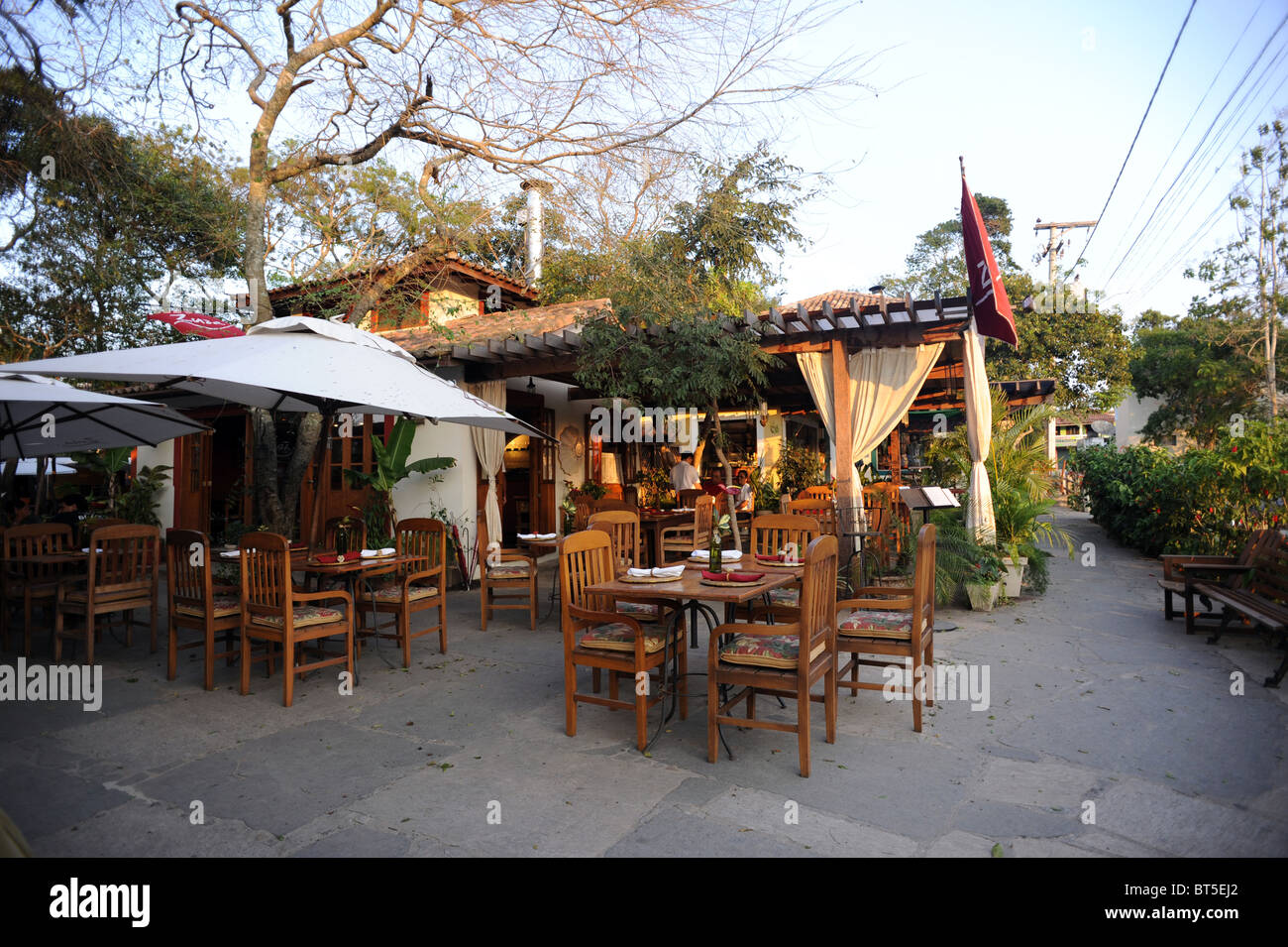 Empty tables in a small restaurant in Buzios Stock Photo - Alamy