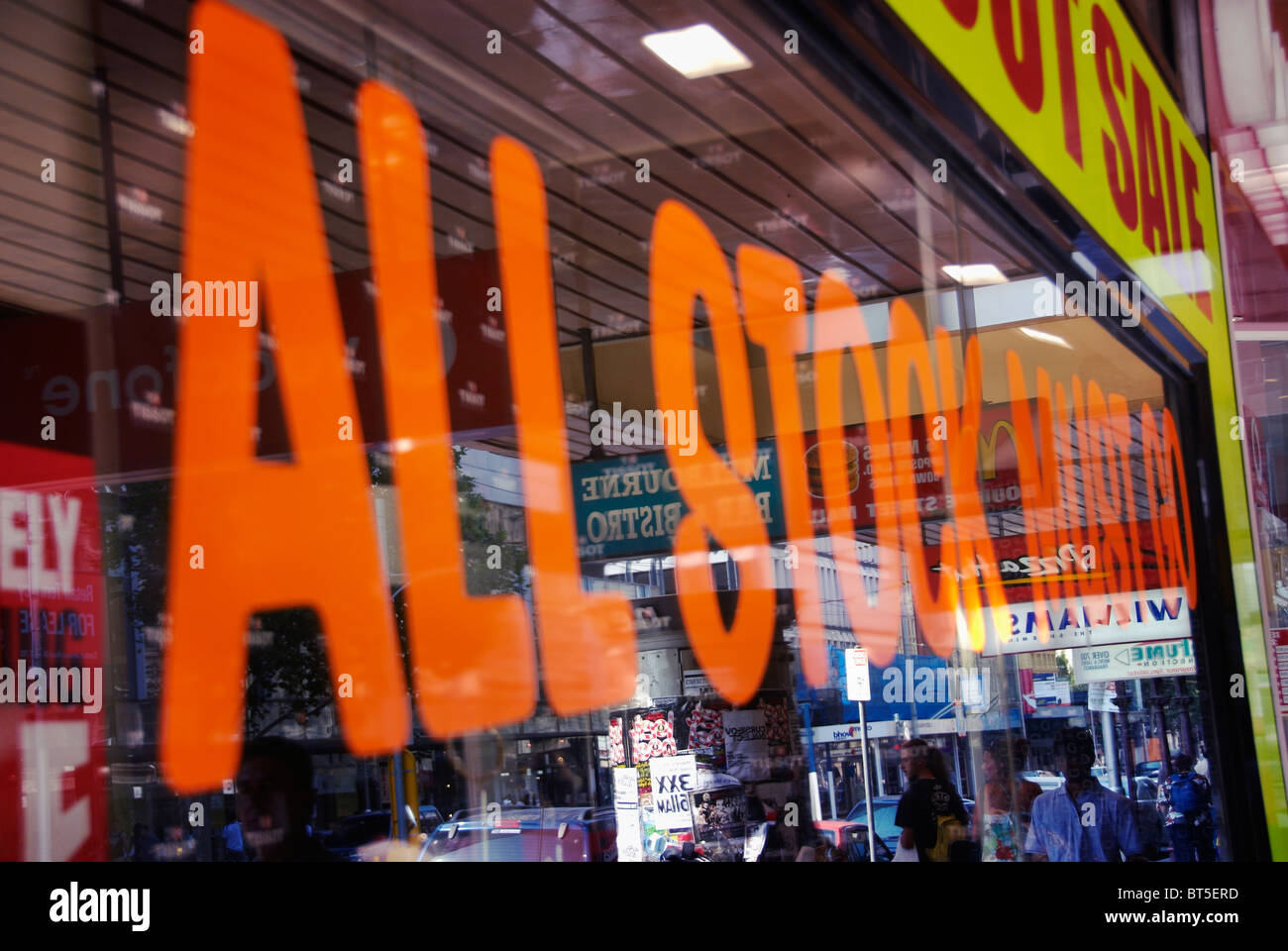 Store window with All Stock reduced on sale sign Stock Photo - Alamy