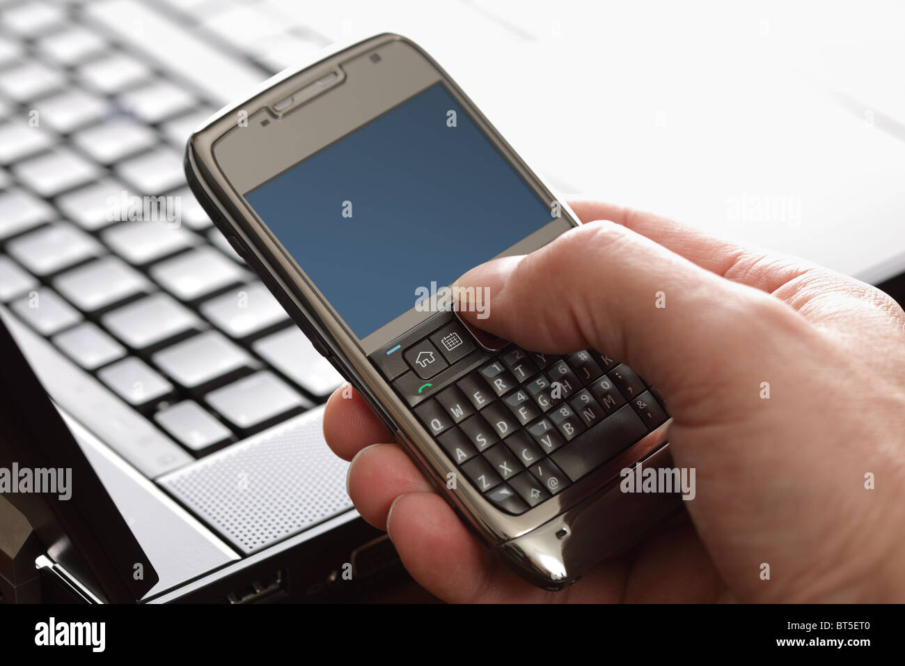 Using a smart mobile phone Stock Photo - Alamy