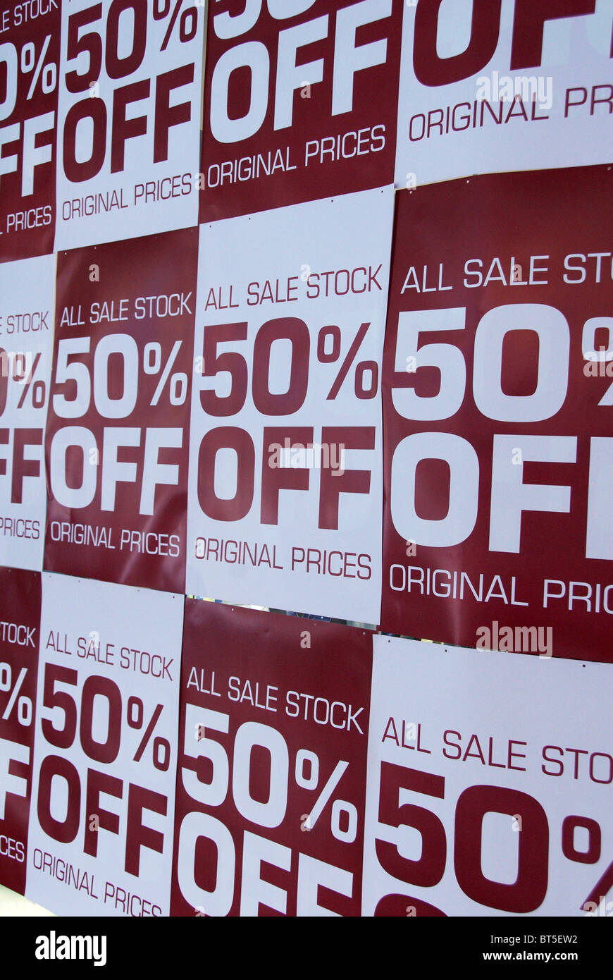 50% off red and white signs on shop window Stock Photo - Alamy