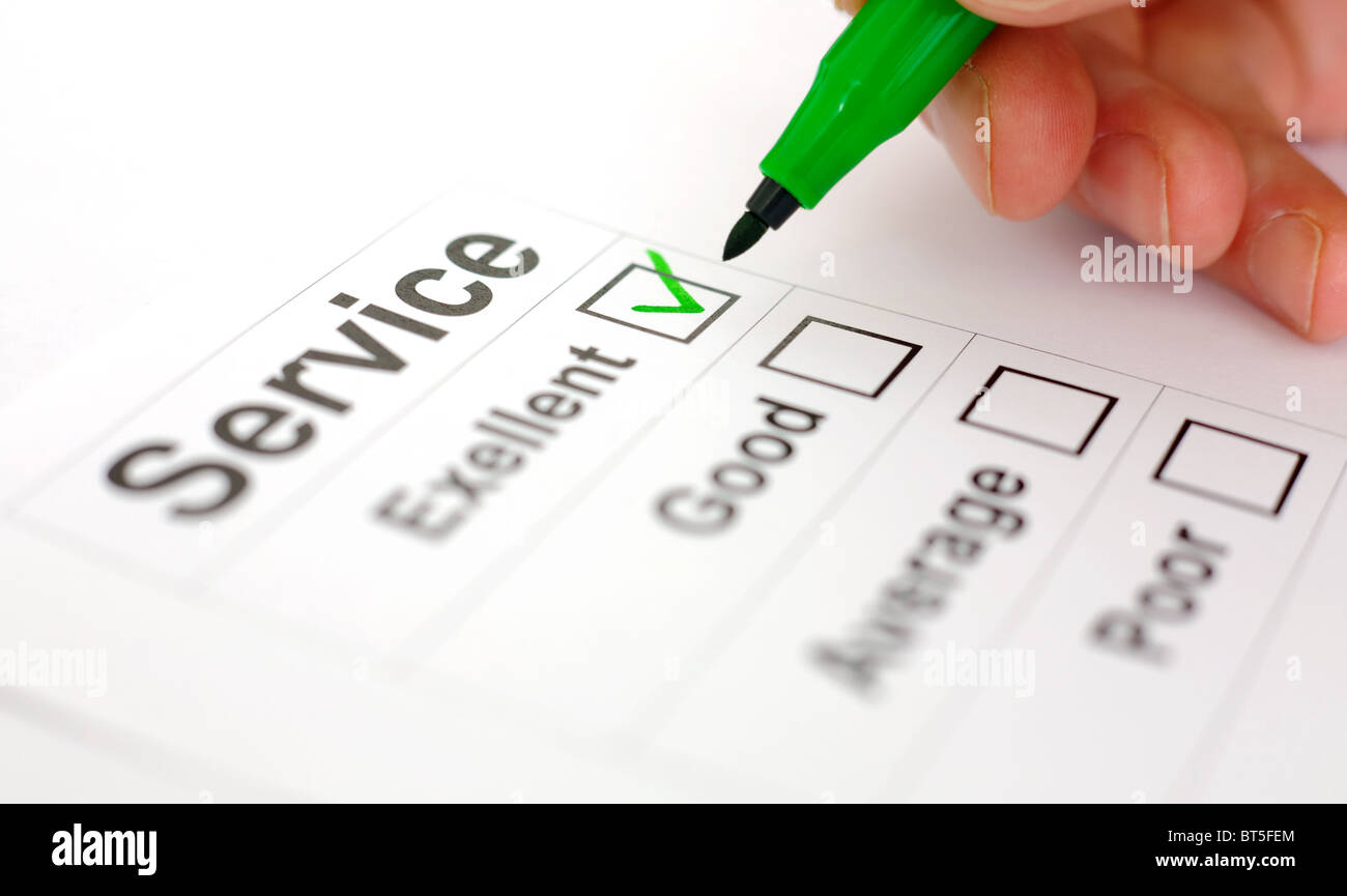 Hand with a marker in a hand filling the questionnaire Stock Photo - Alamy