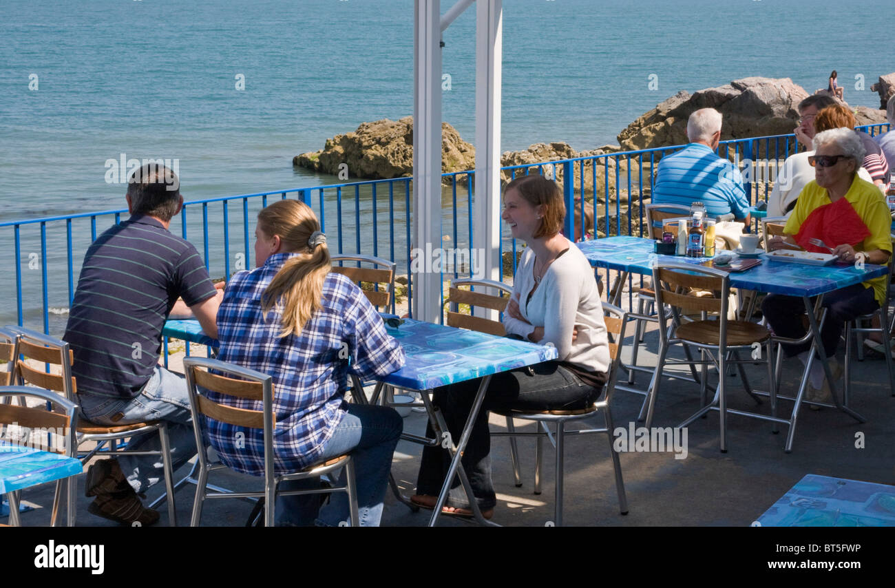 People relax on the beach in torquay hi-res stock photography and ...