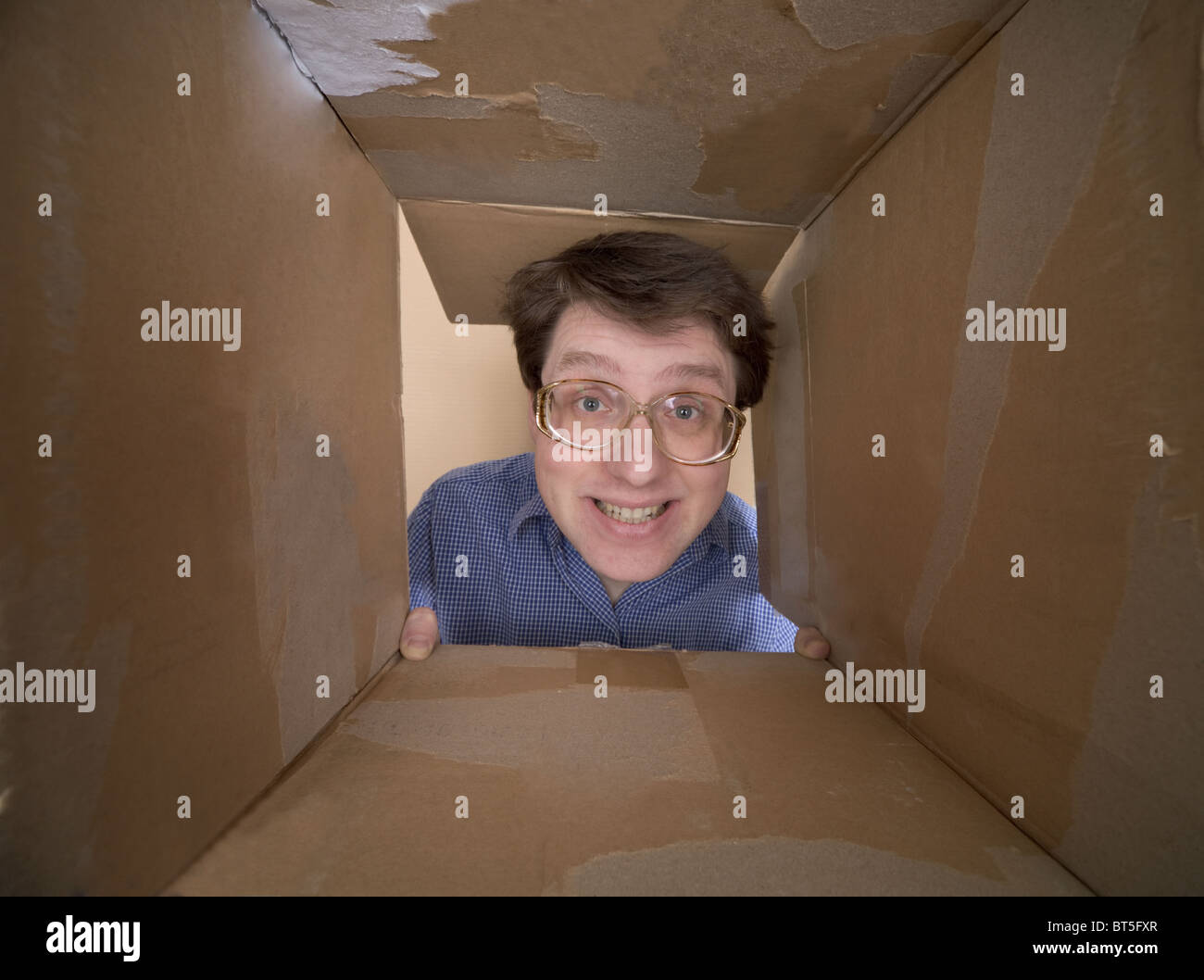 Man portrait on spectacles inside carton box Stock Photo - Alamy