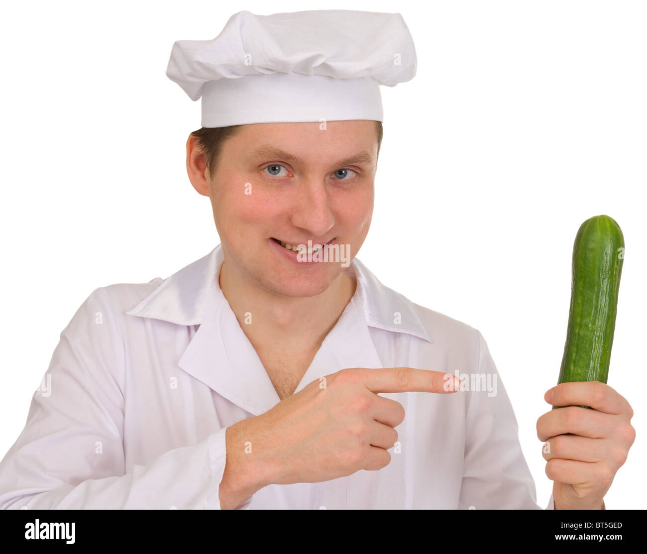 Cook in white overall with cucumber in hand a white background Stock ...