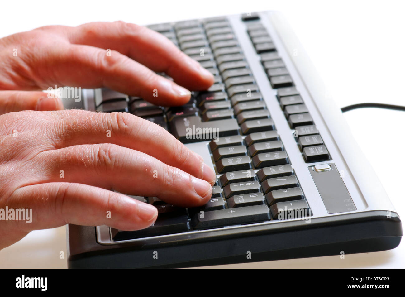 Hands on black computer keyboard Stock Photo - Alamy