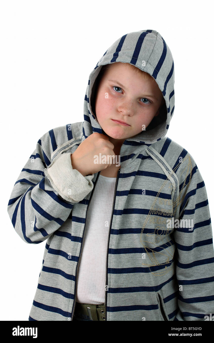 Young thug in gray hood with fist under his chin isolated on white ...