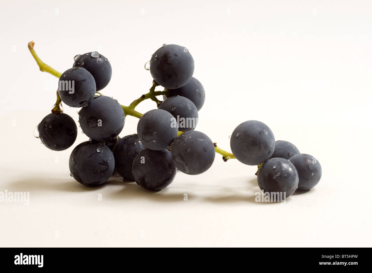 Red grapes isolated on white Stock Photo - Alamy