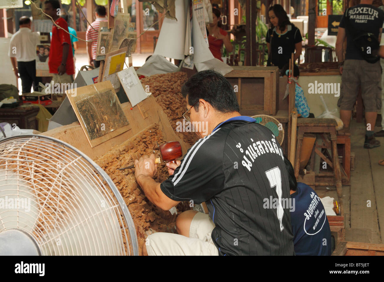 Teak wood engraver man cutting teak wood. Bangkok, Thailand, September ...