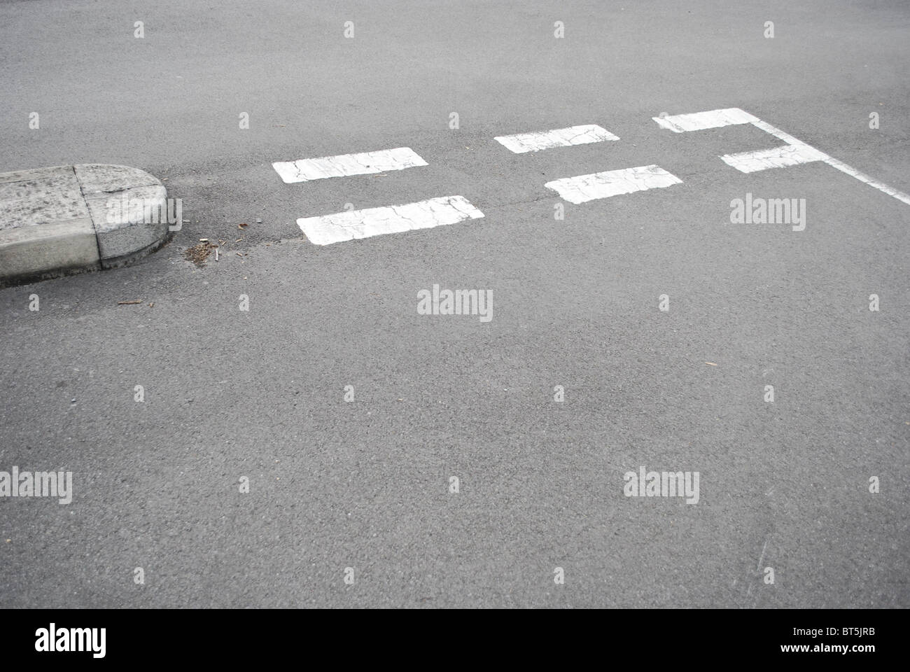 Give way road markings at a junction Stock Photo - Alamy