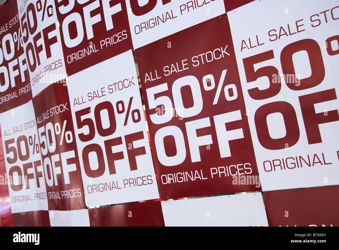 50% off red and white signs on shop window Stock Photo - Alamy