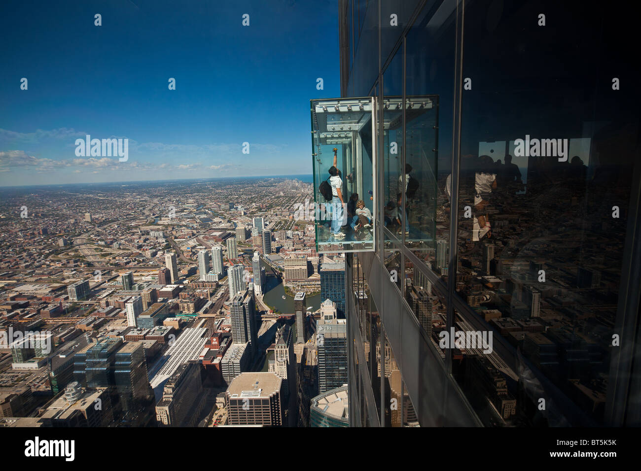Tourists in glass balcony skydeck observation deck view Chicago ...