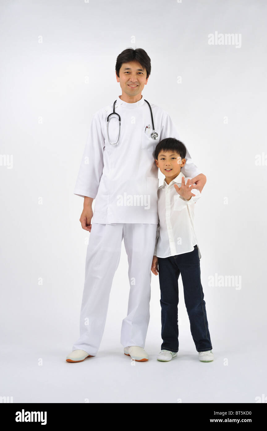 Male doctor and boy Stock Photo - Alamy
