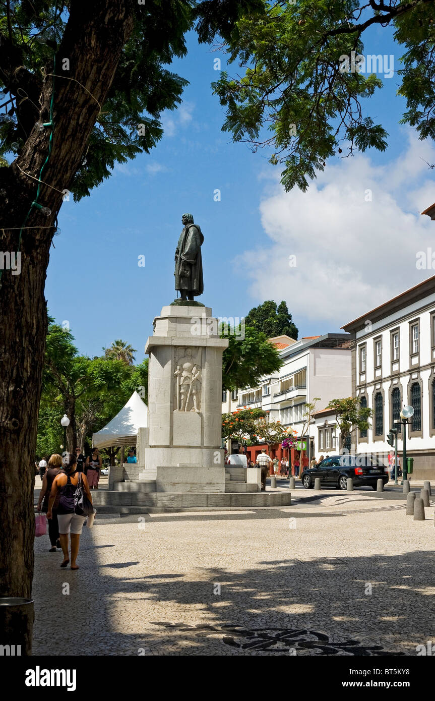 People tourists visitors walking by Statue of Joao Goncalves Zarco in ...