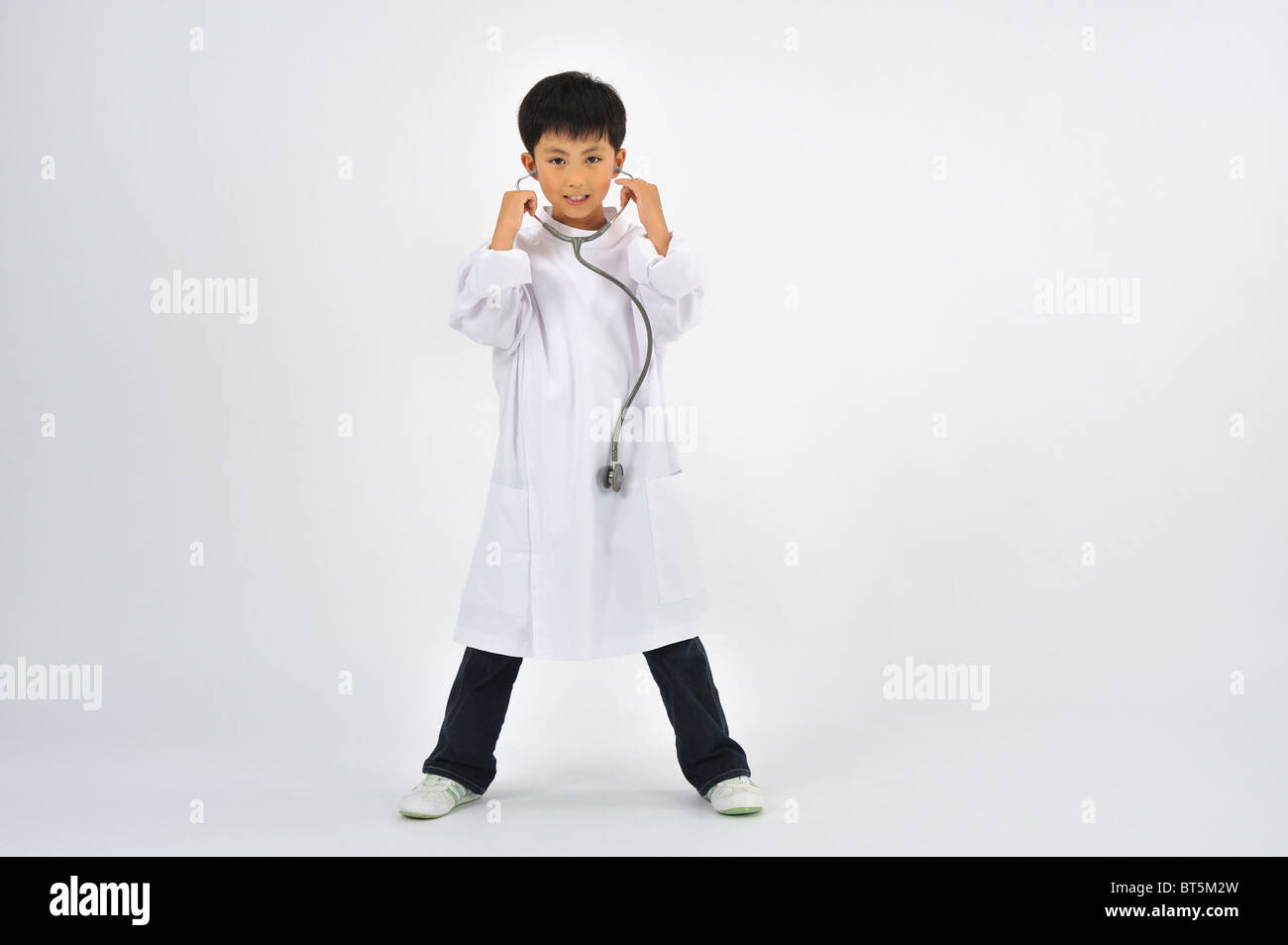 Boy playing as doctor Stock Photo - Alamy